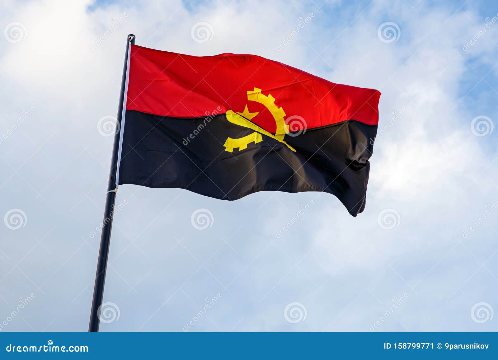 Angola Flag Waving in Front of a Blue Sky Stock Image - Image of ensign ...