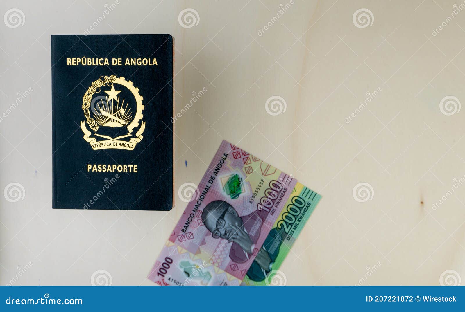 Angolan Passport and New Series of Banknotes Placed on a White Surface ...