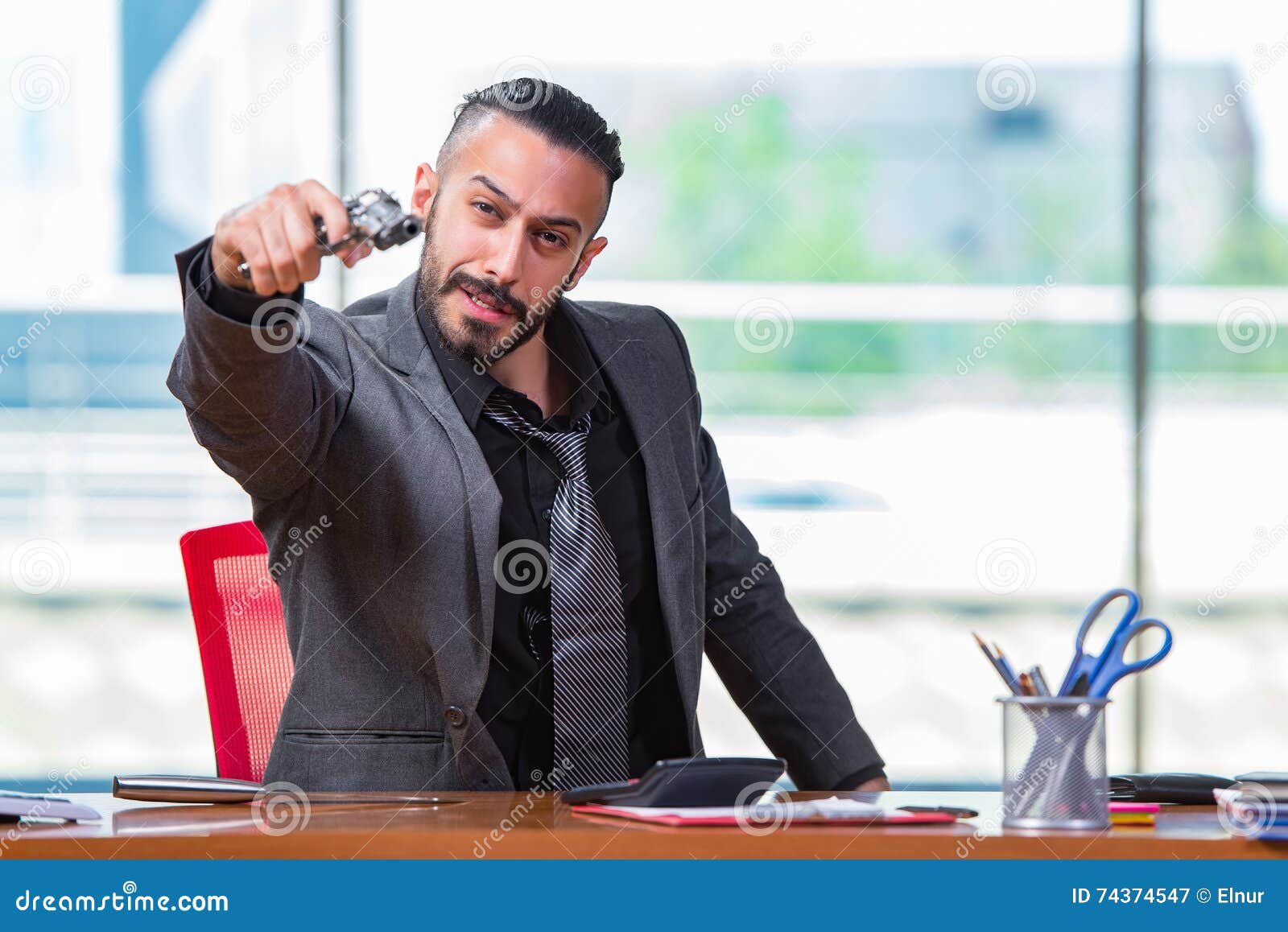The Angry Aggressive Businessman with Gun in the Office Stock Image ...