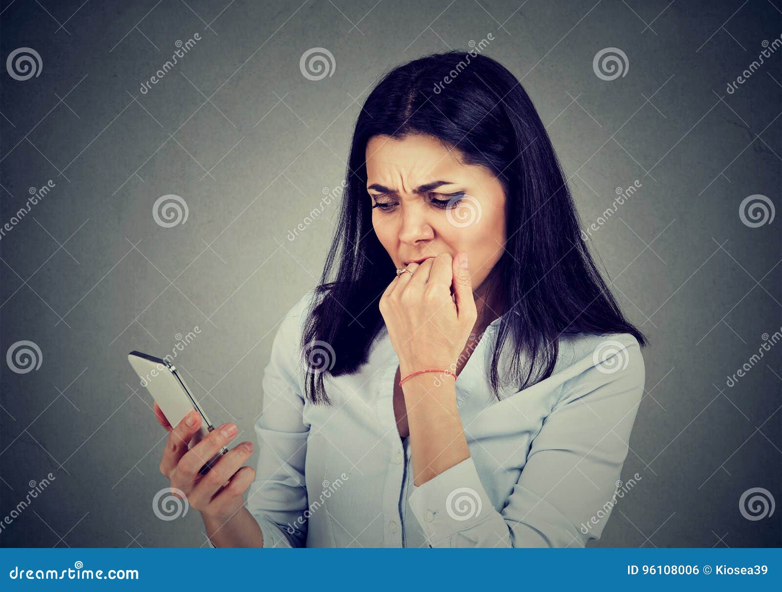Angry Anxious Woman Watching Apps In The Mobile Phone Stock Photo ...