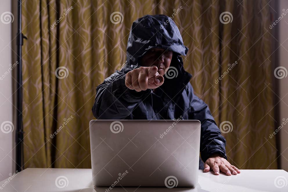 Angry Asian Hacker Pointing Finger To Audience while Hacking Net Stock ...