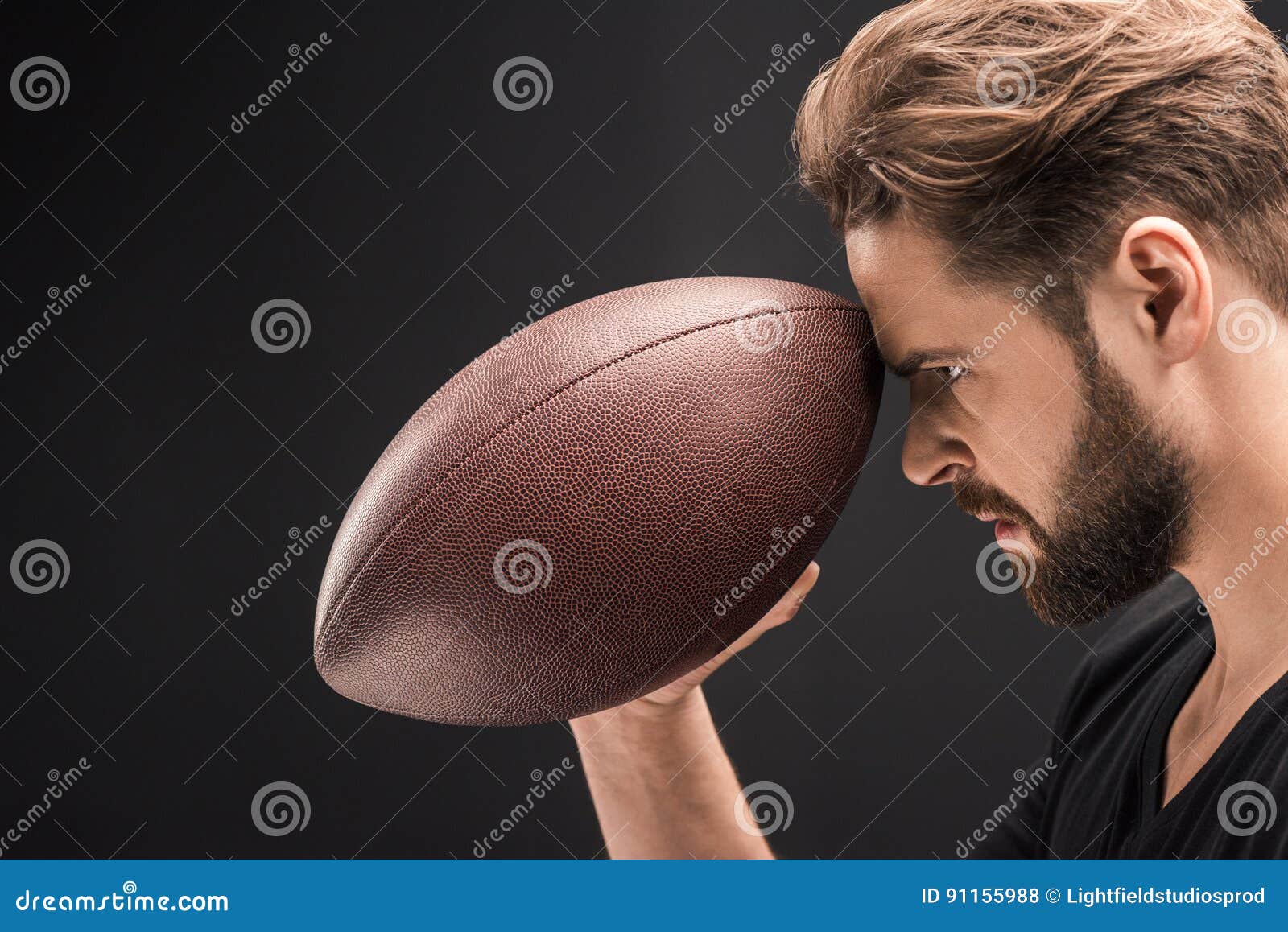 Angry Bearded Man Holding Rugby Ball on Black Stock Photo - Image of ...