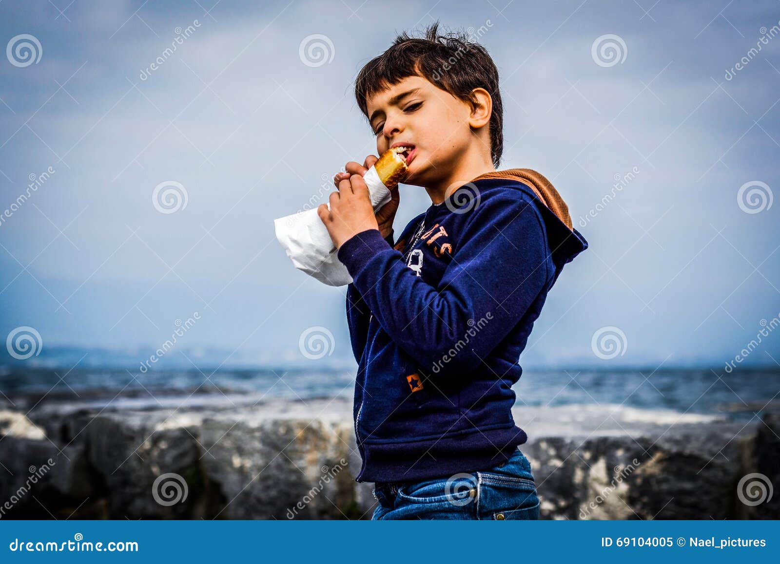Hungry boy stock image. Image of young, coast, lake, cloudy - 69104005