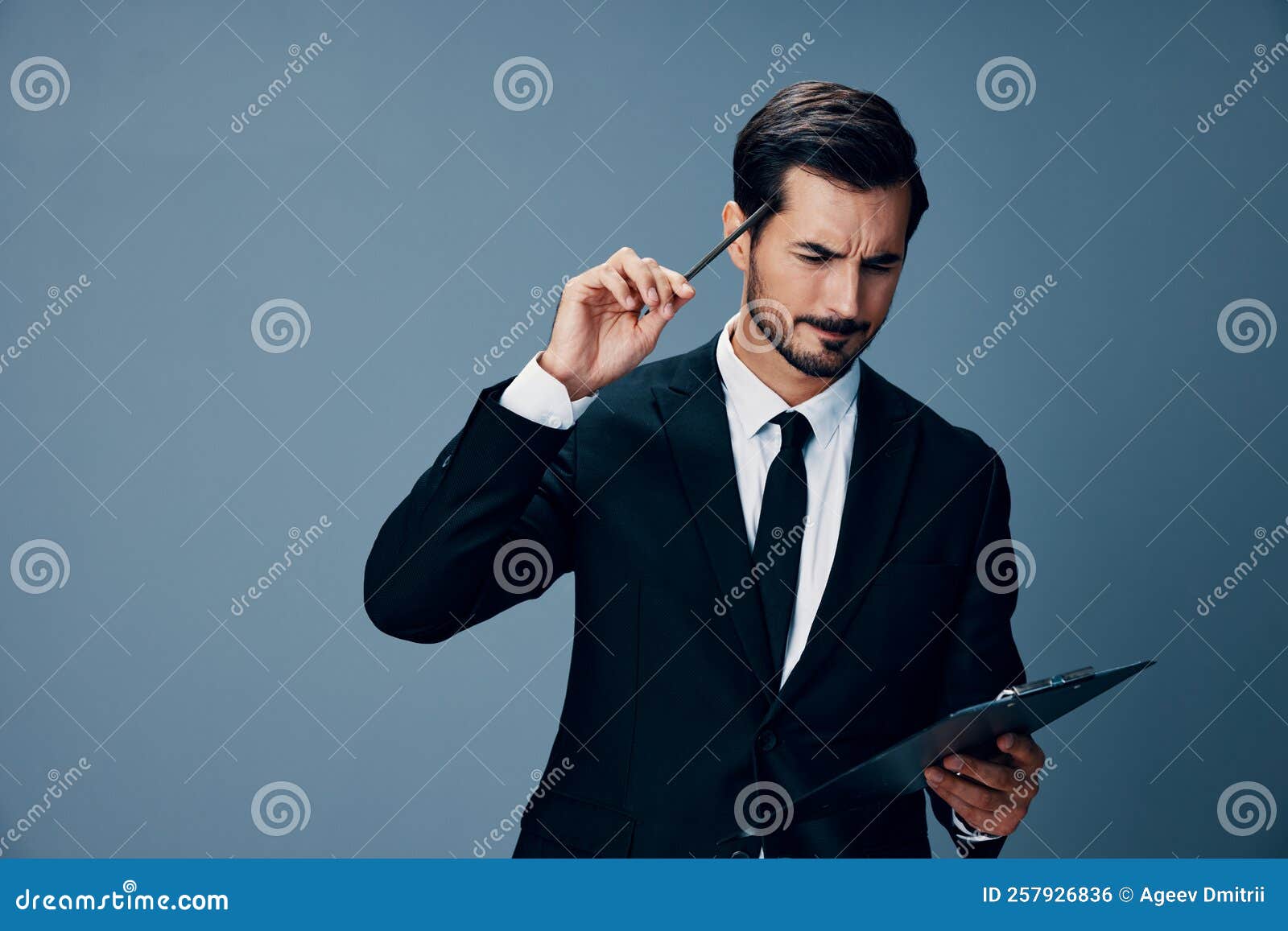 An Angry Business Man with a Headache is Holding a Folder of Notes in ...