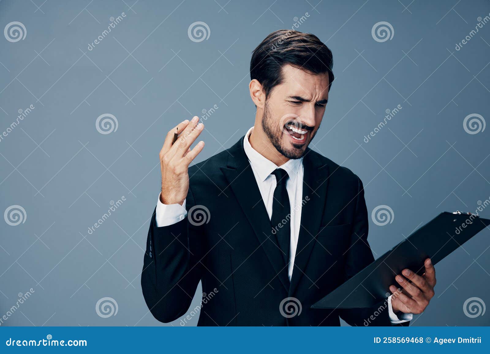 An Angry Business Man with a Headache is Holding a Folder of Notes in ...