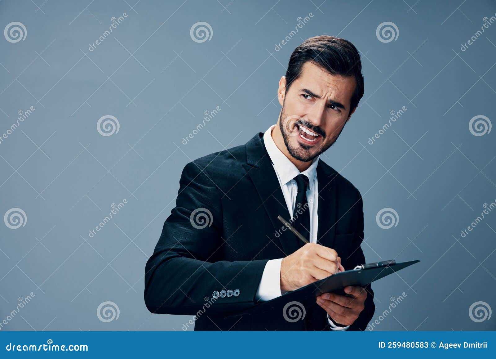 An Angry Business Man with a Headache is Holding a Folder of Notes in ...