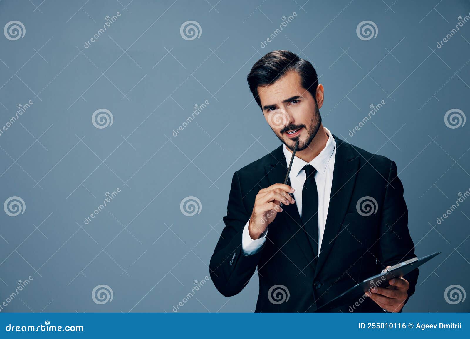 An Angry Business Man with a Headache is Holding a Folder of Notes in ...