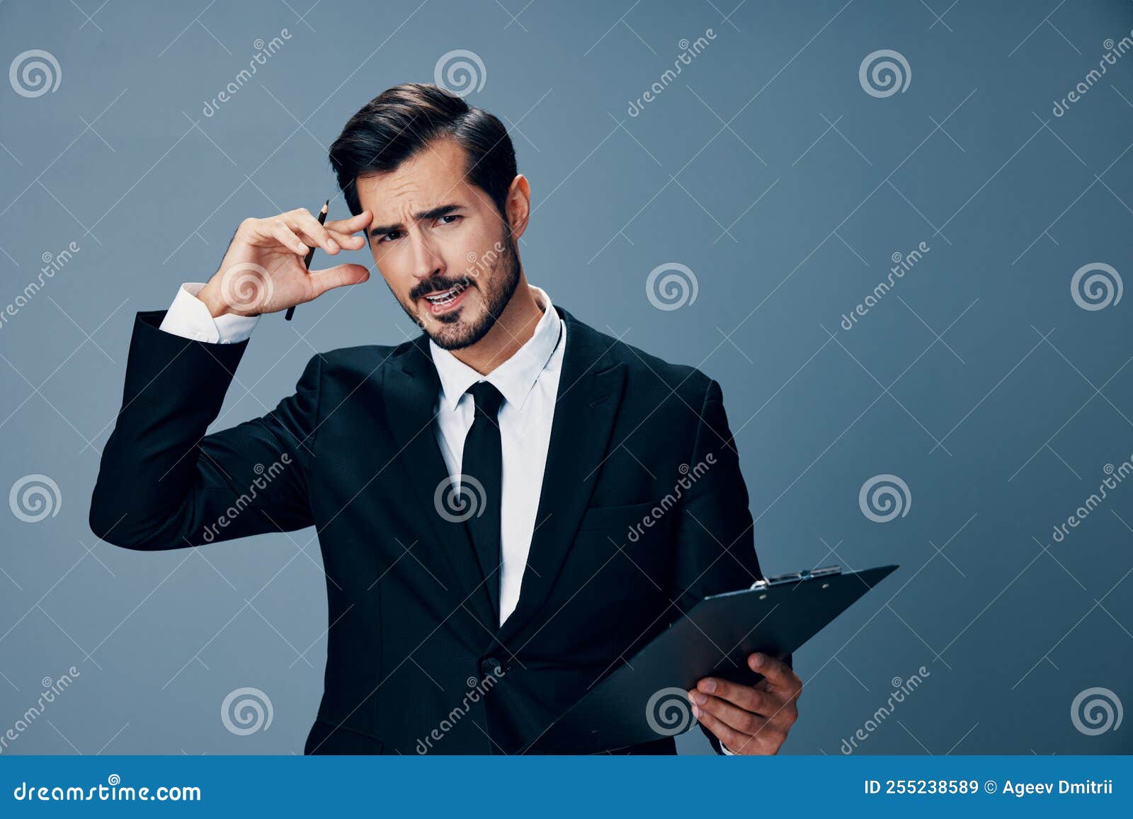 An Angry Business Man with a Headache is Holding a Folder of Notes in ...
