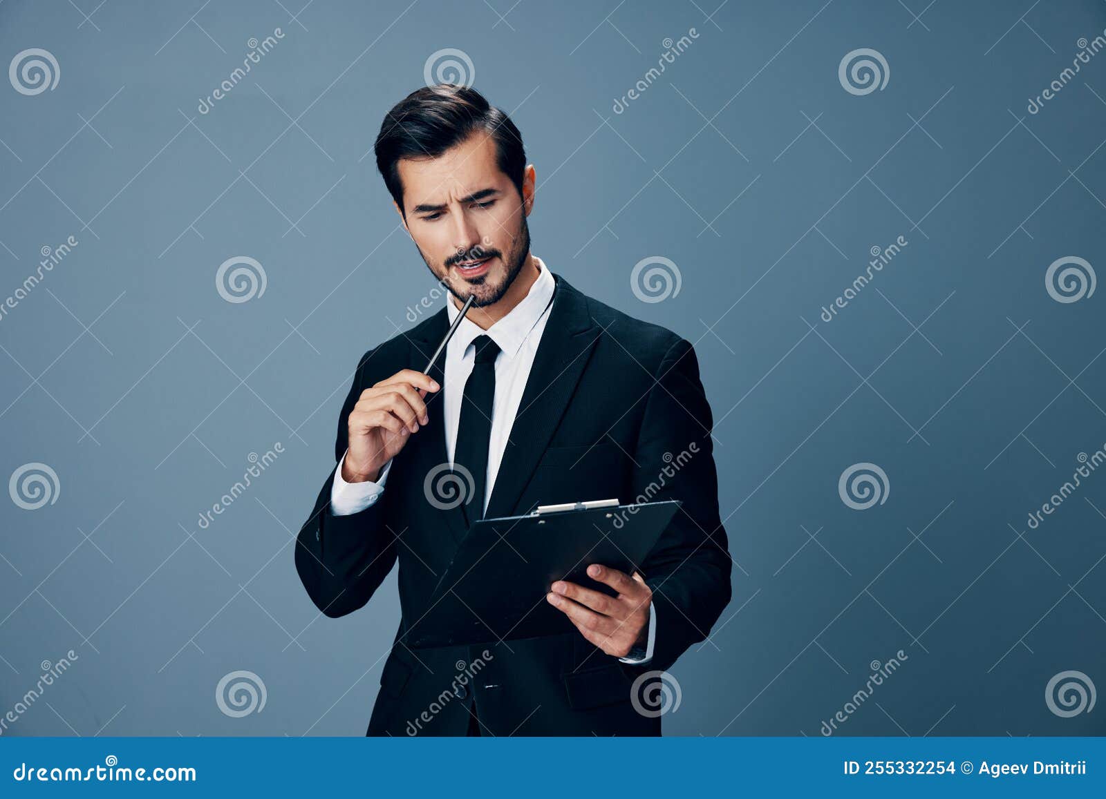 An Angry Business Man with a Headache is Holding a Folder of Notes in ...