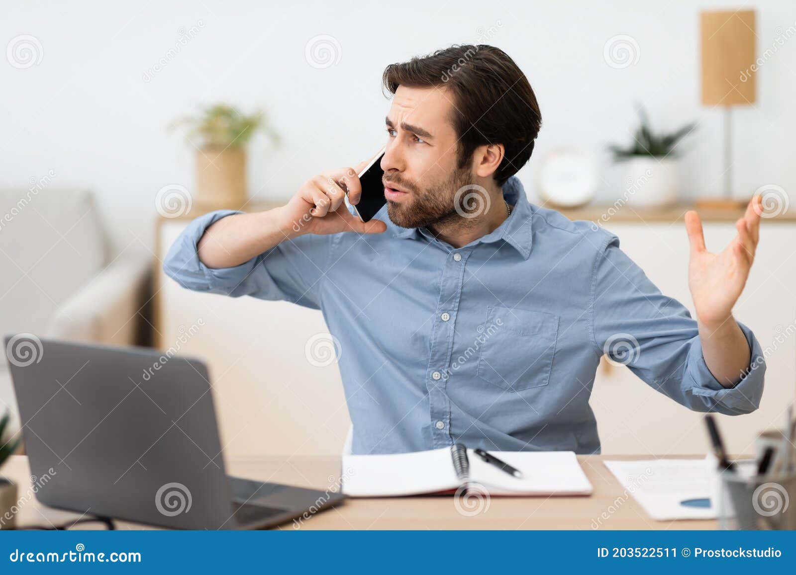 Angry Businessman Calling by Phone Having Problems Sitting at Workplace ...