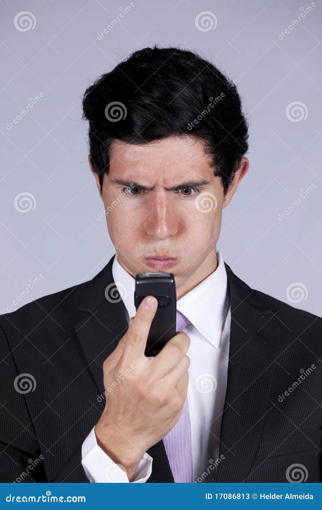 Angry Businessman Looking To His Cellphone Stock Image - Image of ...