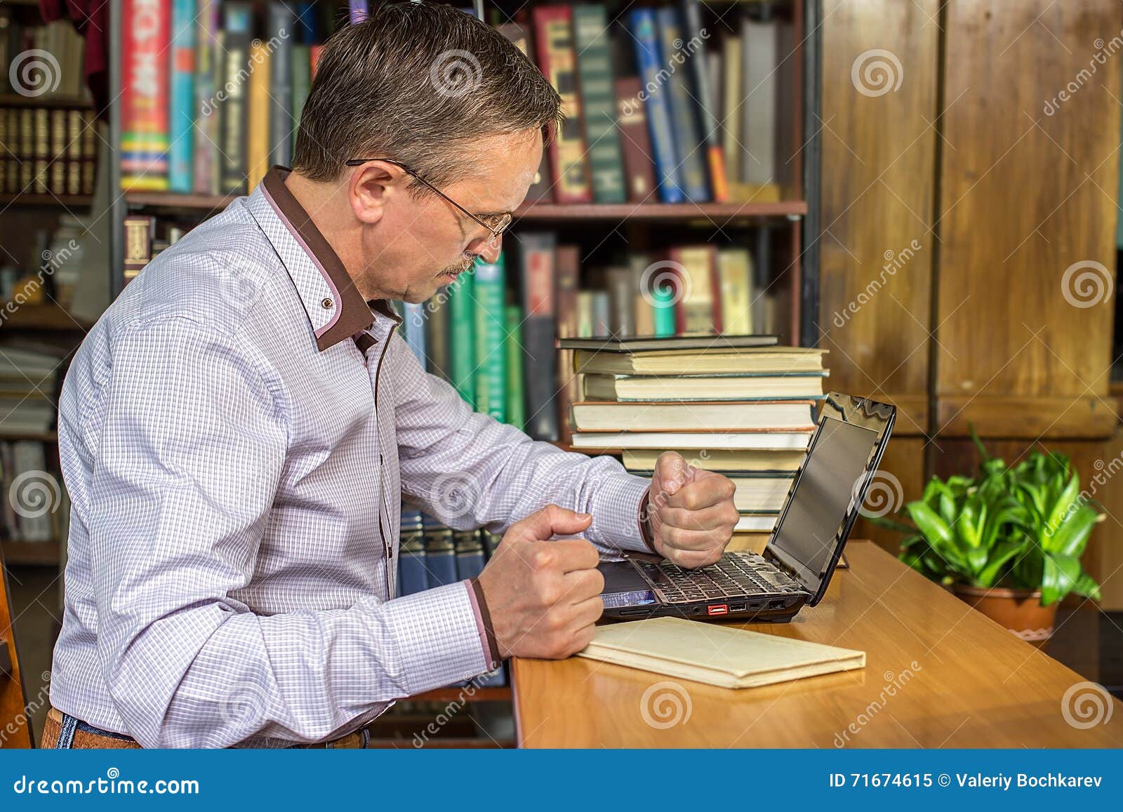 An Angry Businessman Punches His Computer after Getting Upset Stock ...