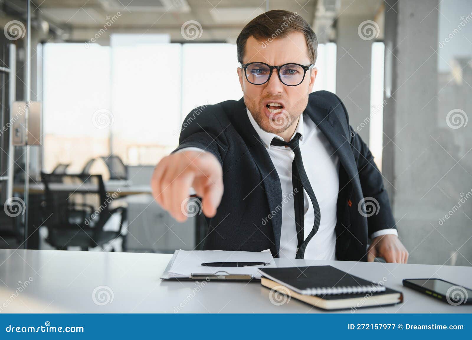 Angry Businessman Sitting at the Table and Screaming. Stock Image ...