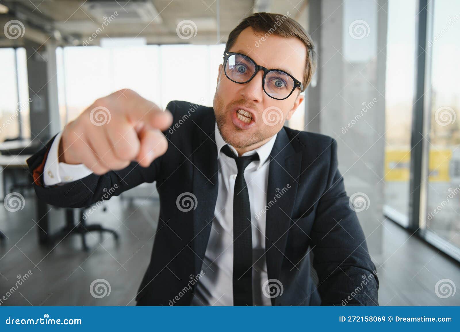 Angry Businessman Sitting at the Table and Screaming. Stock Image ...