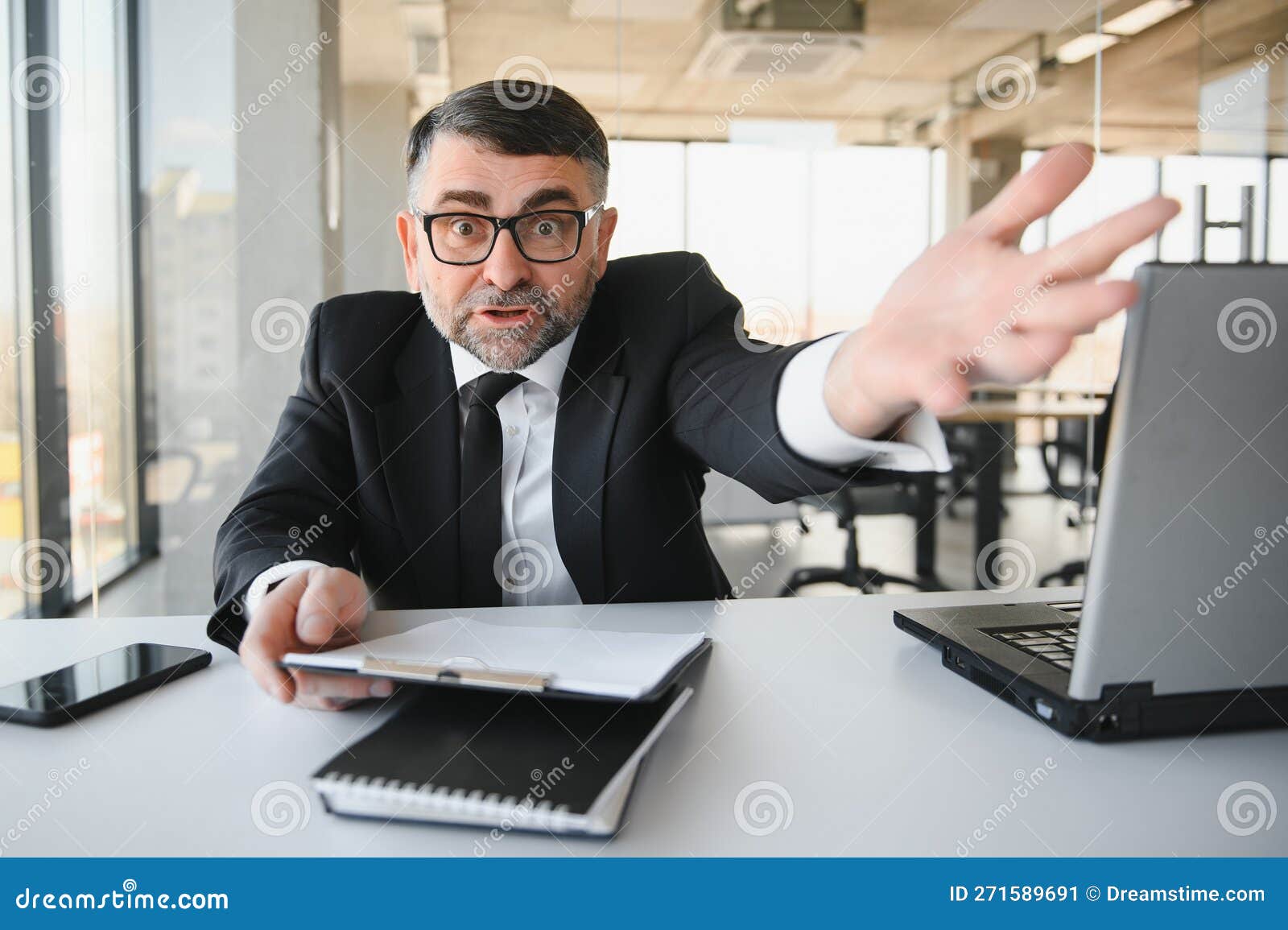 Angry Businessman Sitting at the Table and Screaming Over. Stock Image ...