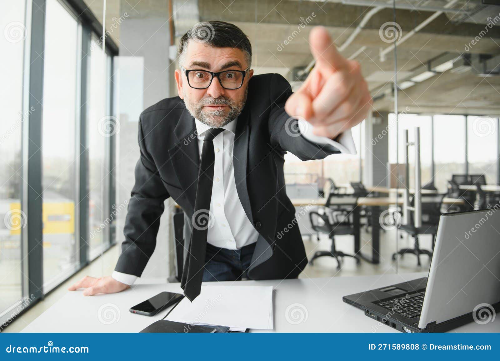 Angry Businessman Sitting at the Table and Screaming Over. Stock Photo ...