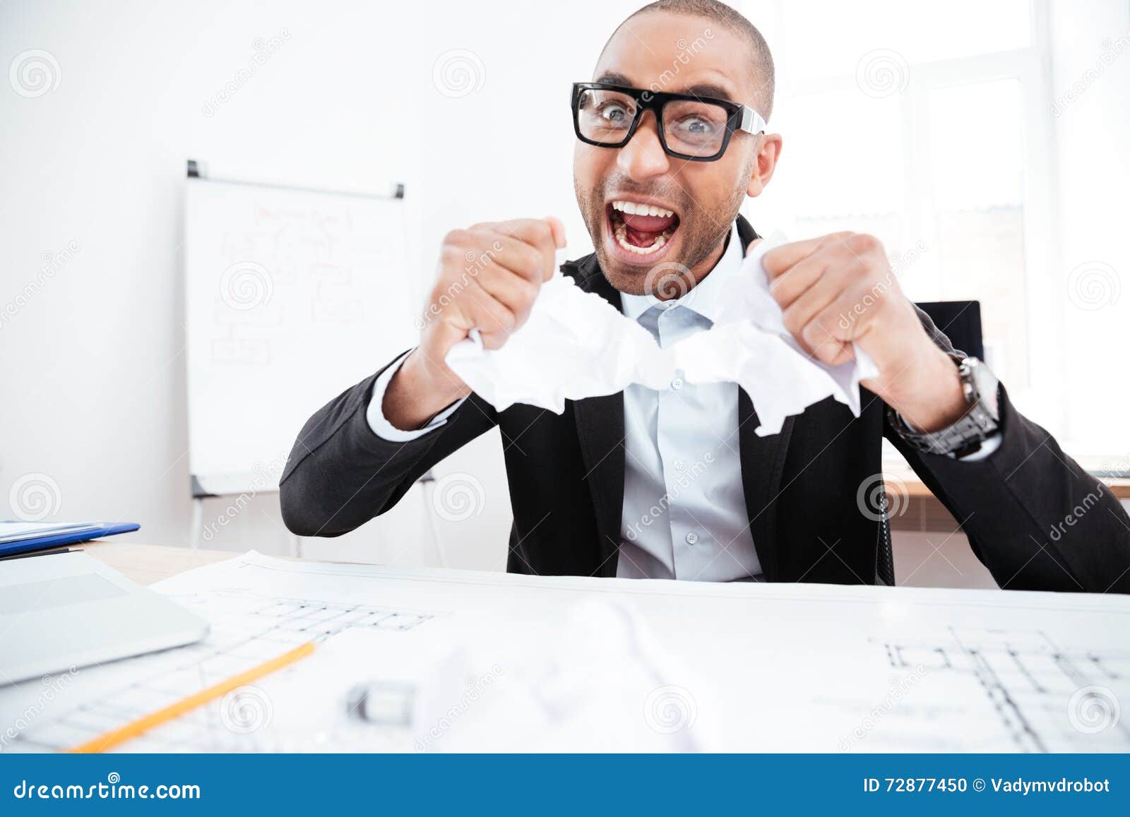 Angry Businessman Tearing Up a Document in Office Stock Photo - Image ...