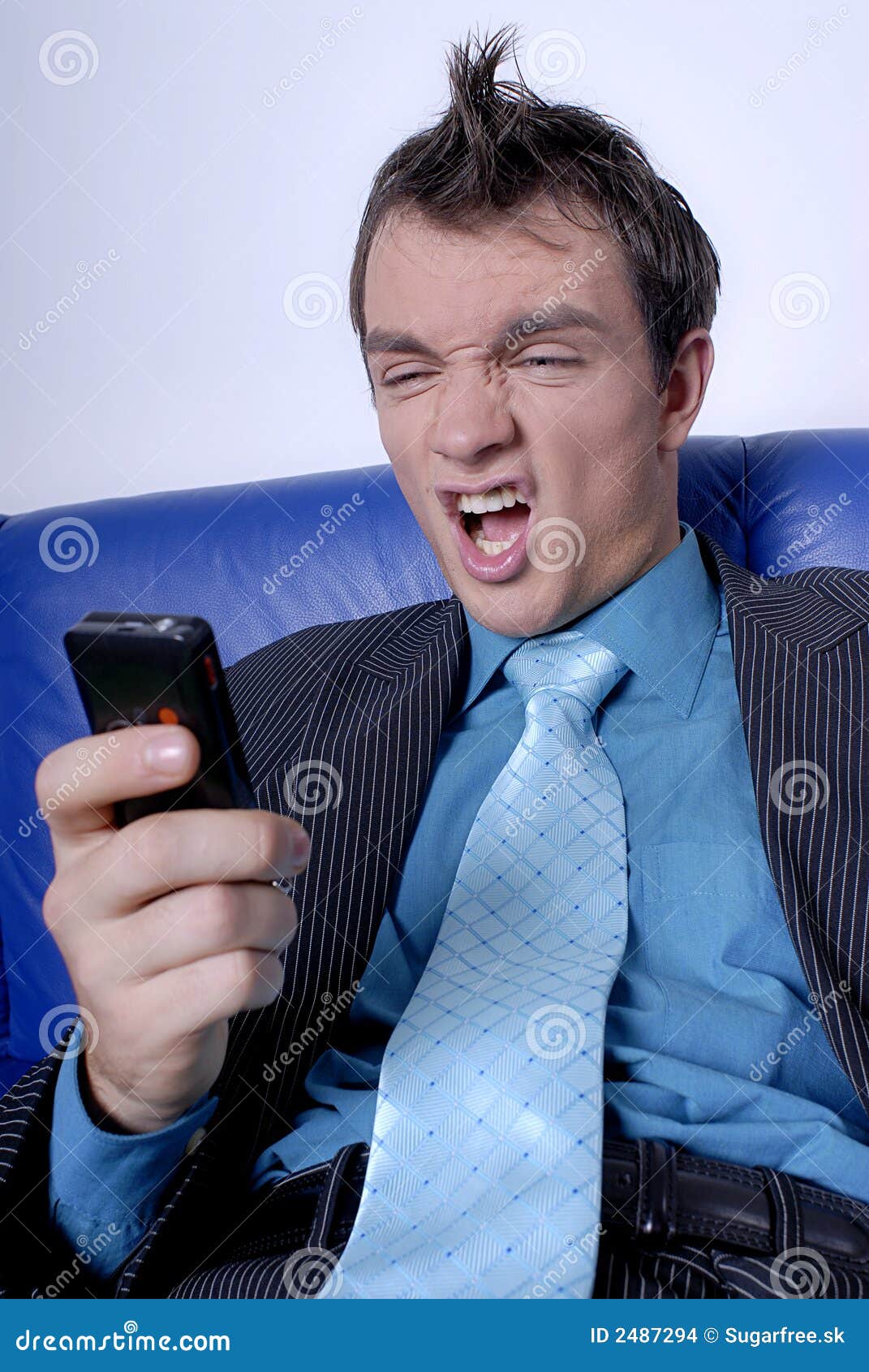 Angry Businessman To Phone stock photo. Image of assess - 2487294