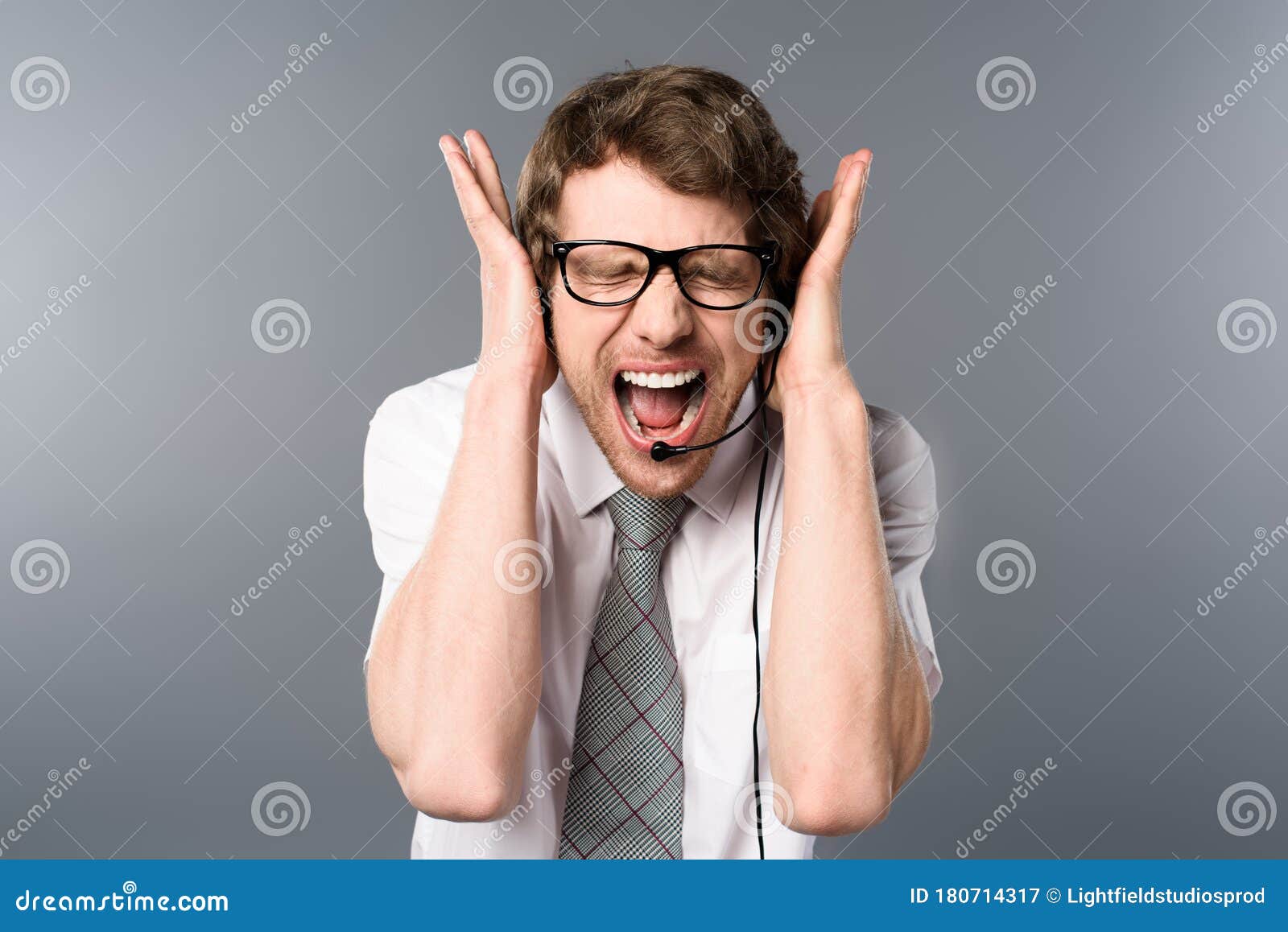 Angry Call Center Operator in Headset and Glasses Screaming with Hands ...
