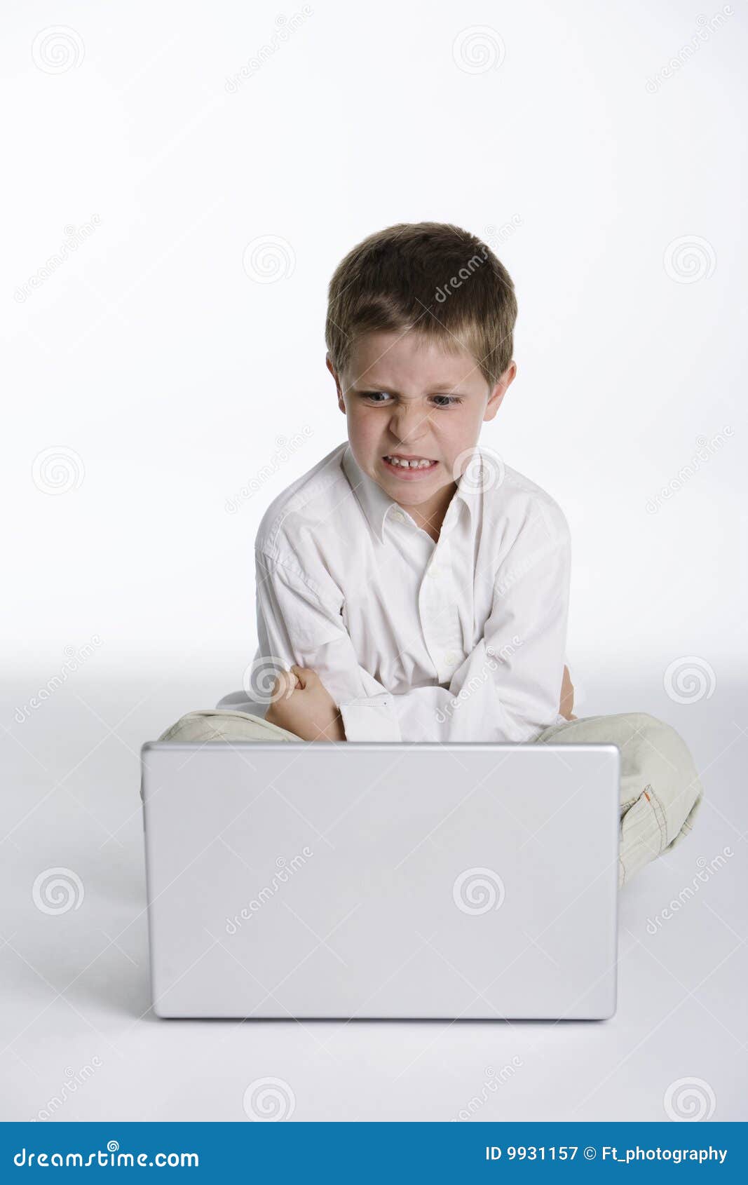 Angry child with computer stock image. Image of grumpy - 9931157