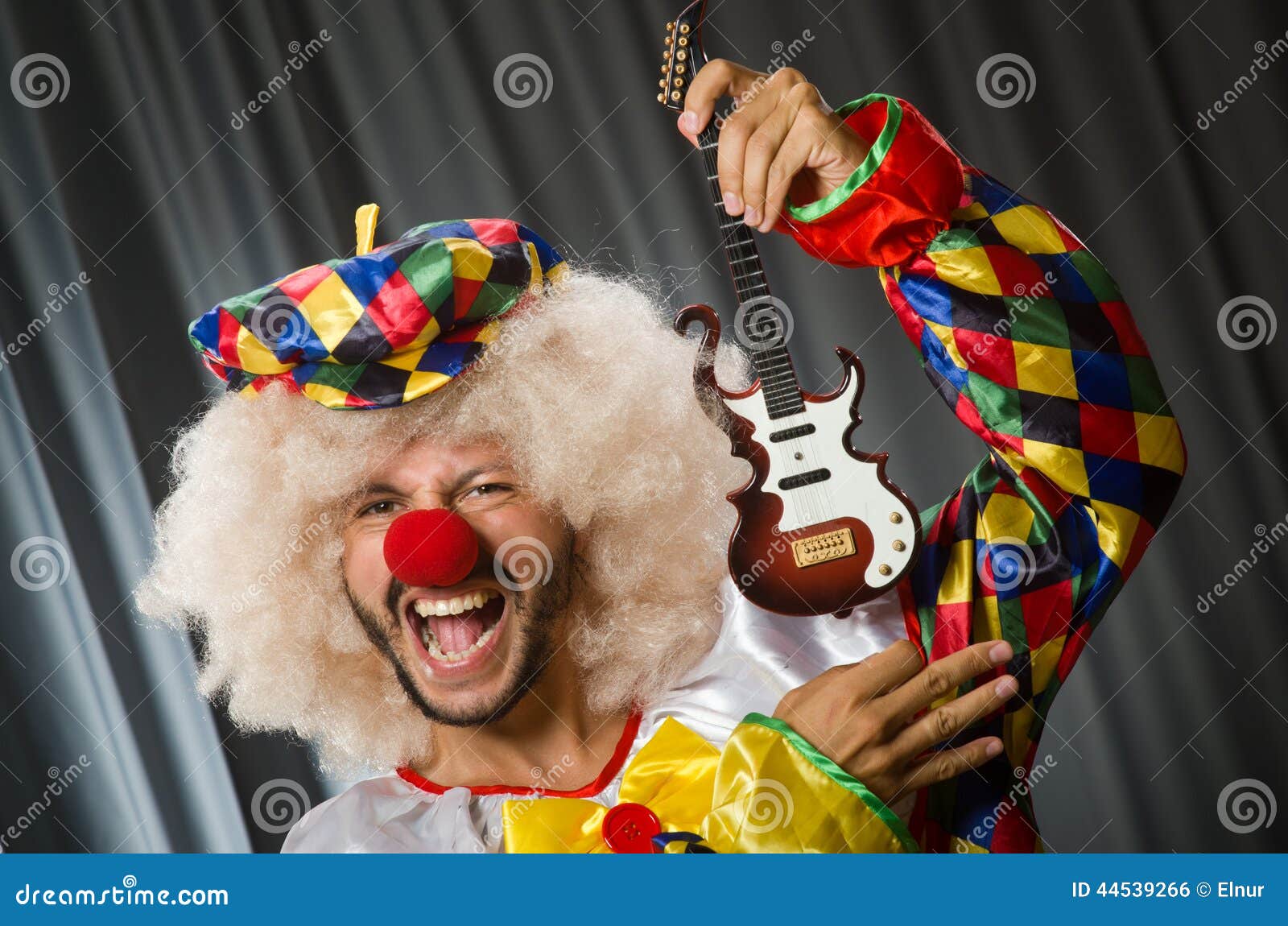 Angry clown with guitar stock photo. Image of carnival - 44539266