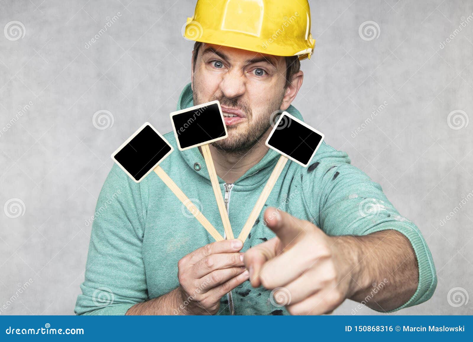 Angry Construction Worker Holding a Blackboard with Space for Text or ...