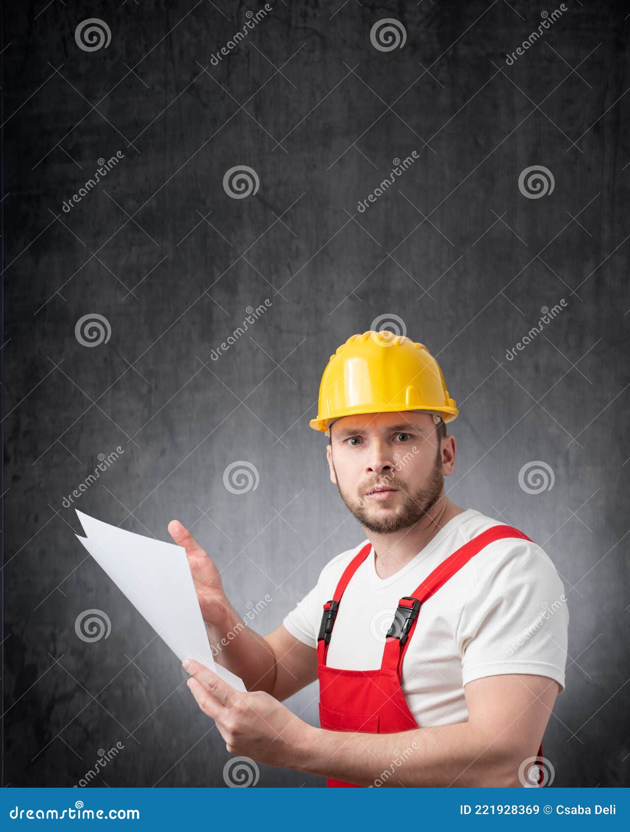 An Angry Construction Worker Holding Papers or Documents Stock Image ...