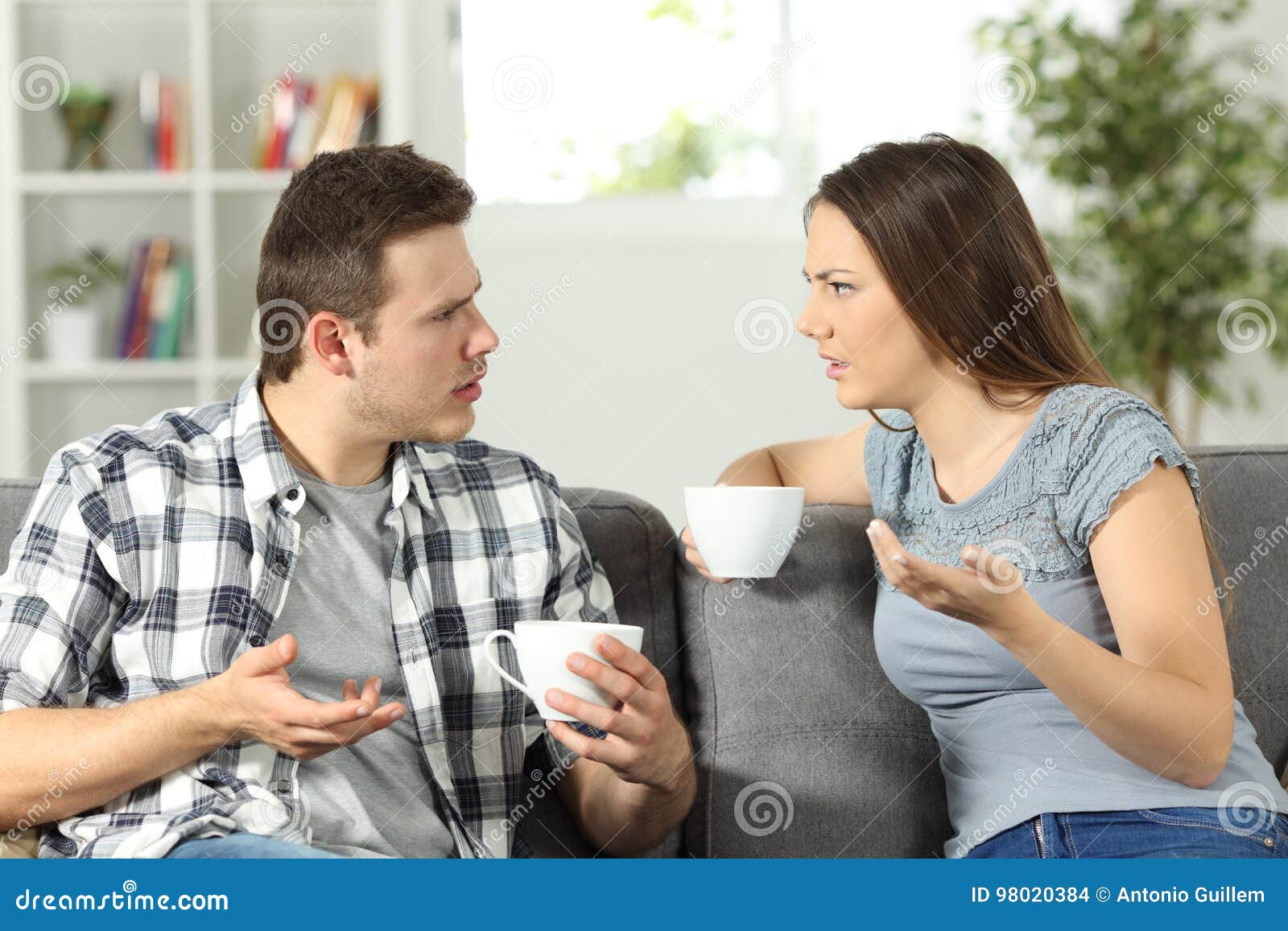 Angry Couple Arguing at Home Stock Photo - Image of chatting, angry ...