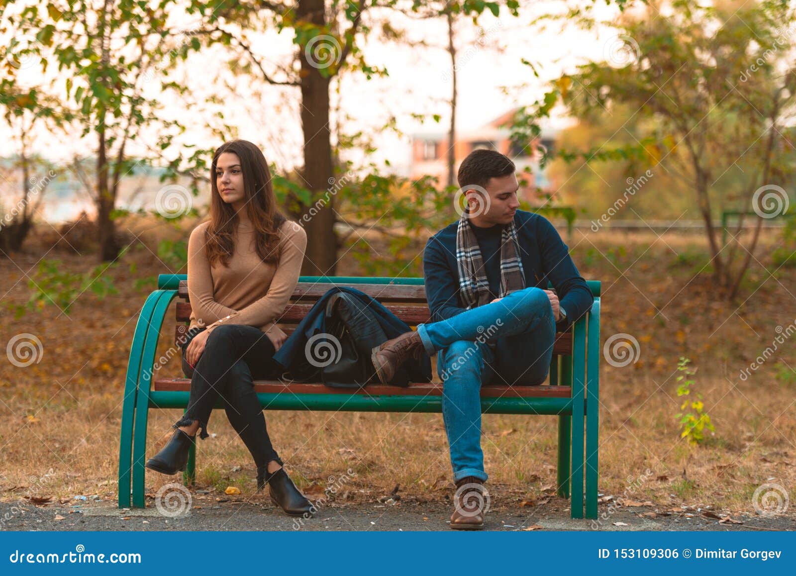 Angry Couple Sitting on a Bench and Looking in Opposite Directions ...
