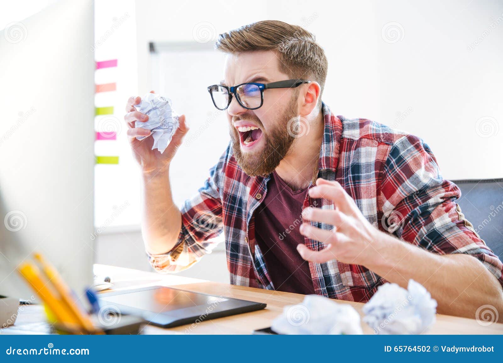 Angry Crazy Designer Yelling and Crumpling Paper on His Workplace Stock ...