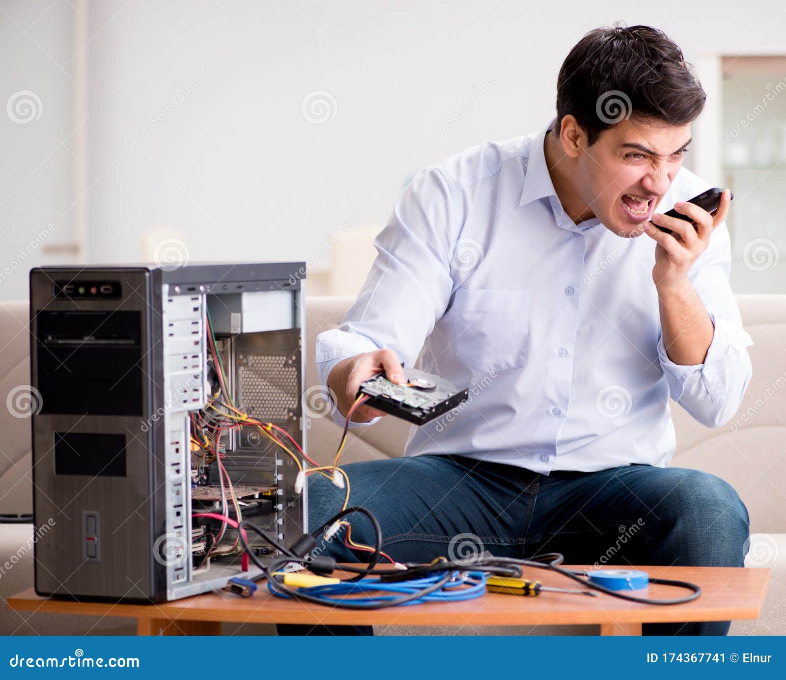 Angry Customer Trying To Repair Computer with Phone Support Stock Image ...