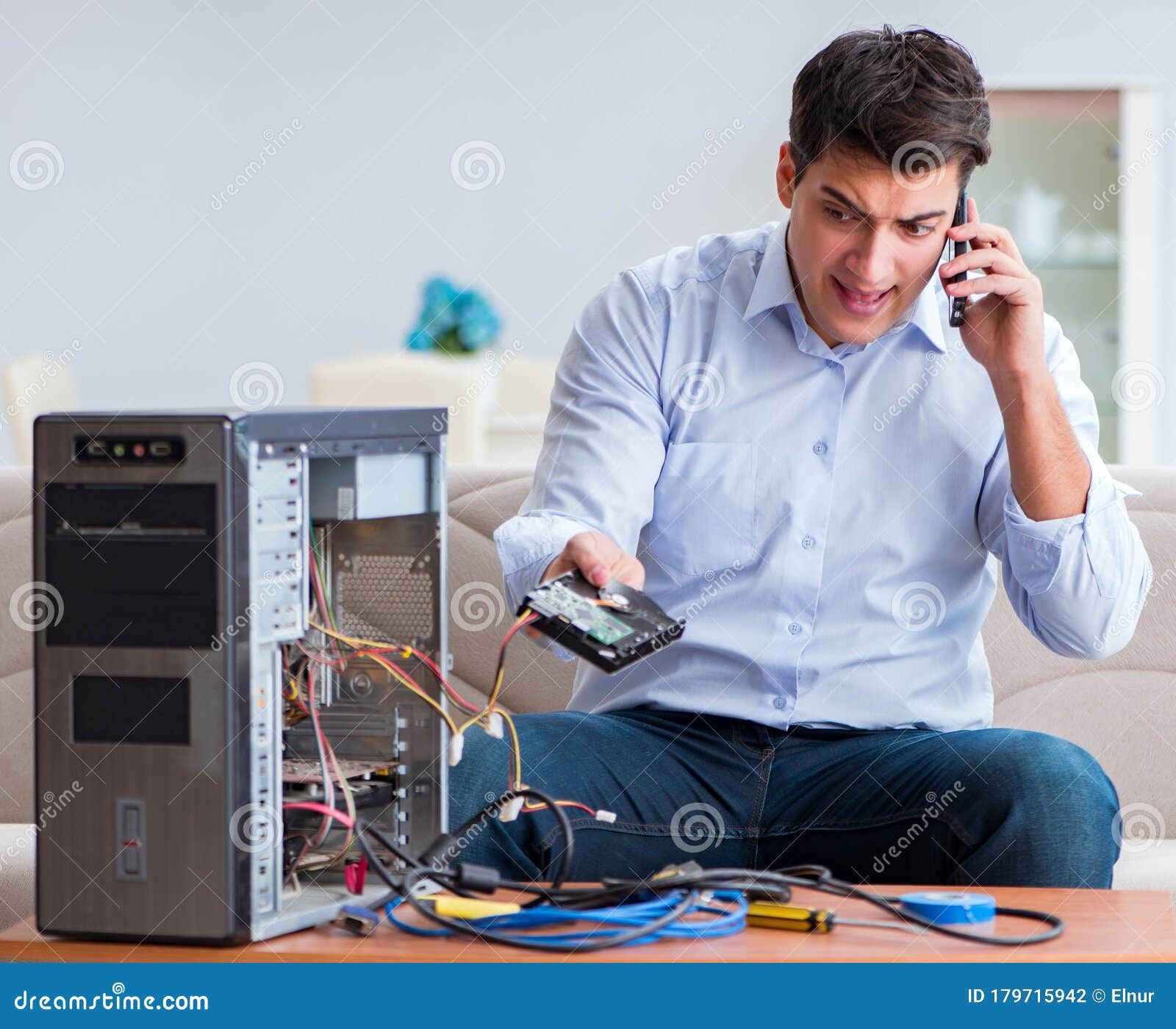 Angry Customer Trying To Repair Computer with Phone Support Stock Photo ...