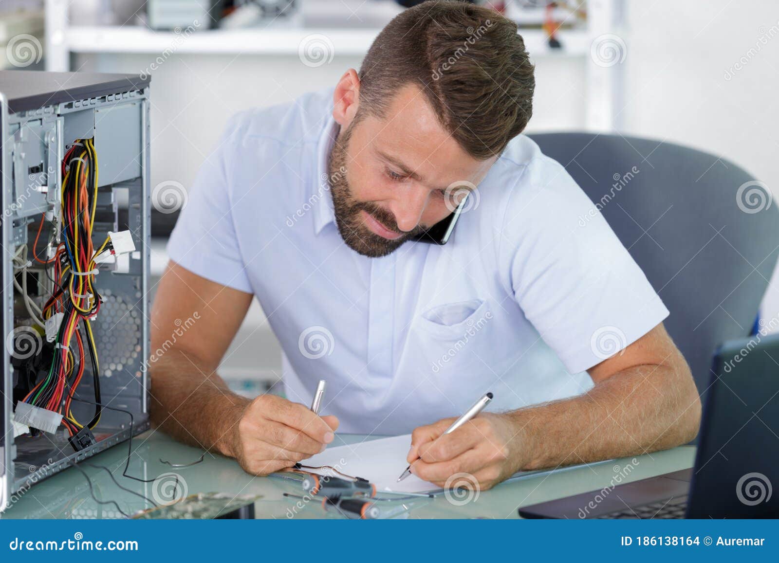 Angry Customer Trying To Repair Computer with Phone Support Stock Photo ...