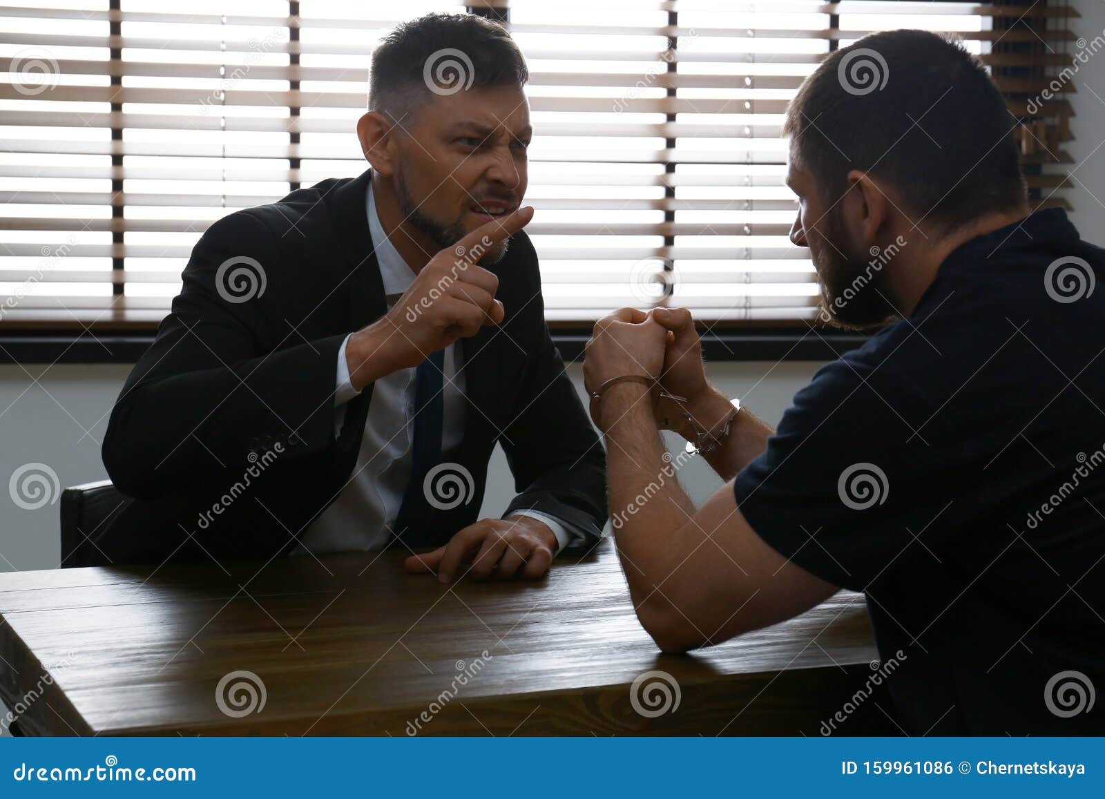 Angry Detective Interviewing Criminal in Room Stock Photo - Image of ...