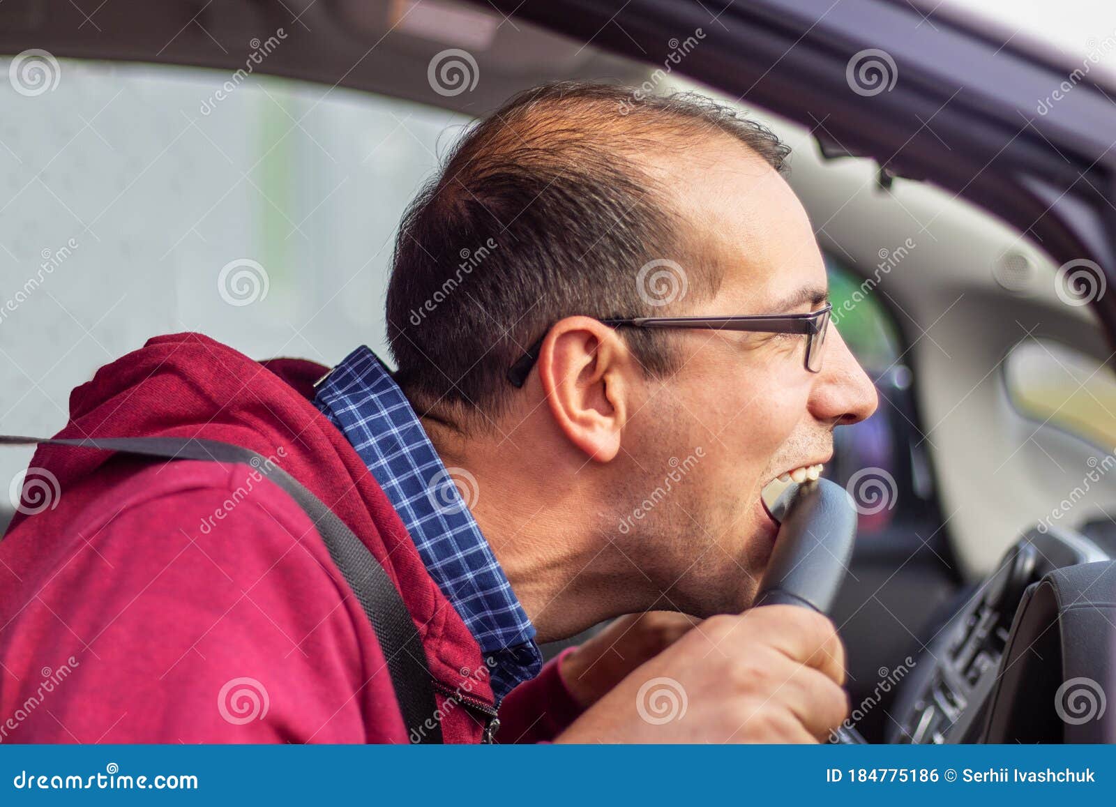 Angry Driver Bites the Steering Wheel in Traffic Jam Stock Photo ...