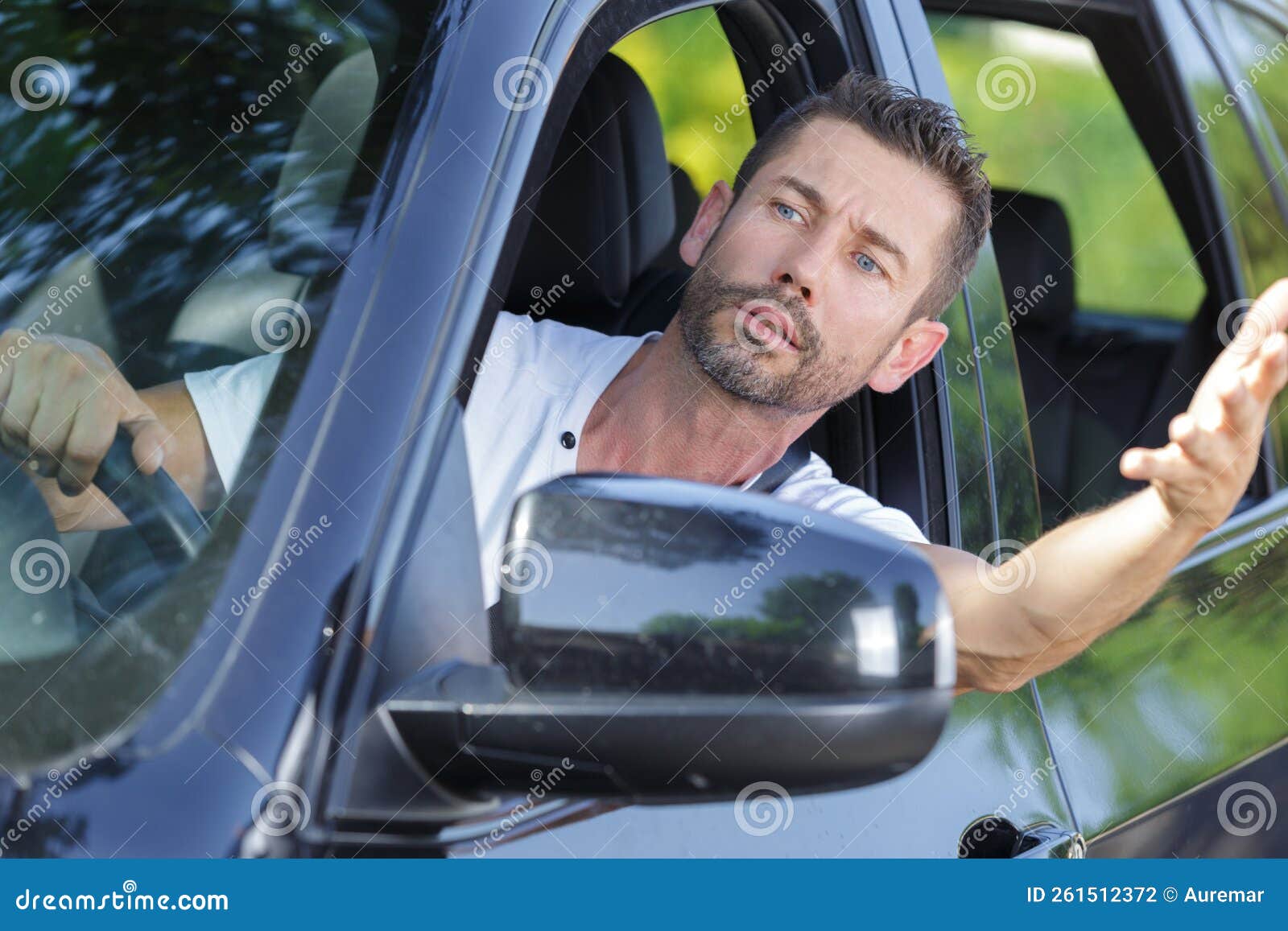 Angry driver in black car stock photo. Image of aggressive - 261512372