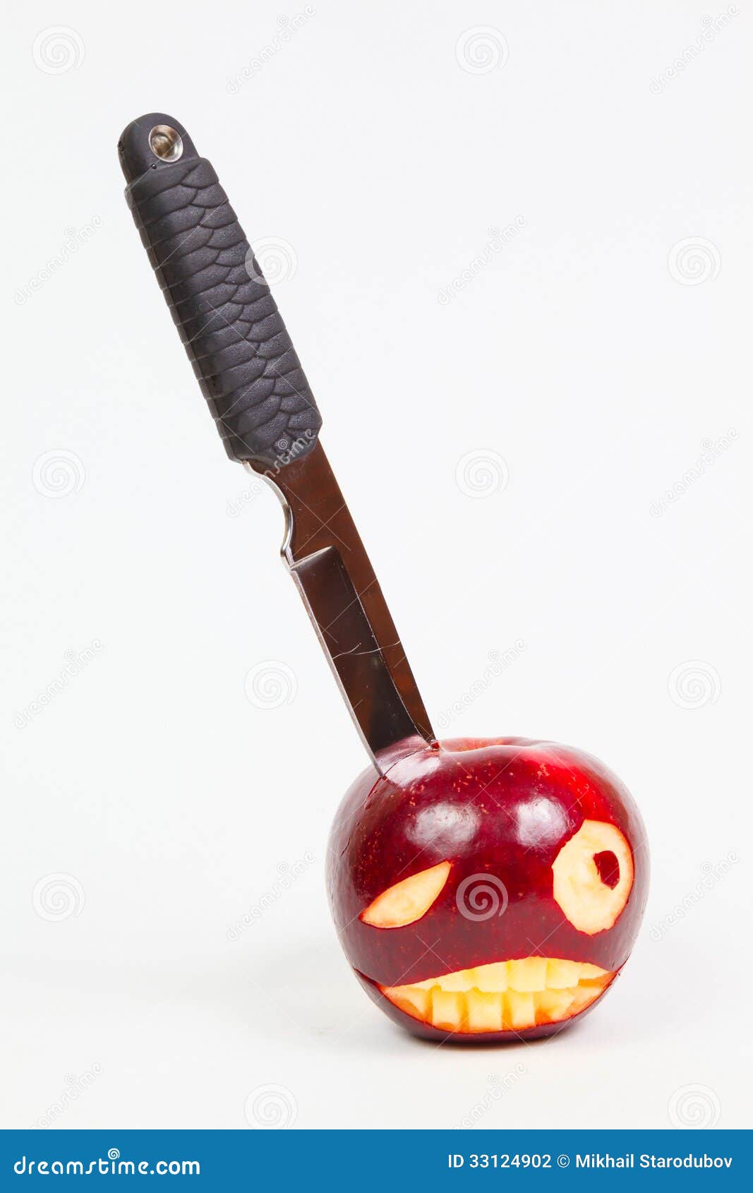 Angry Face is Carved on an Apple and a Knife Stock Photo - Image of ...