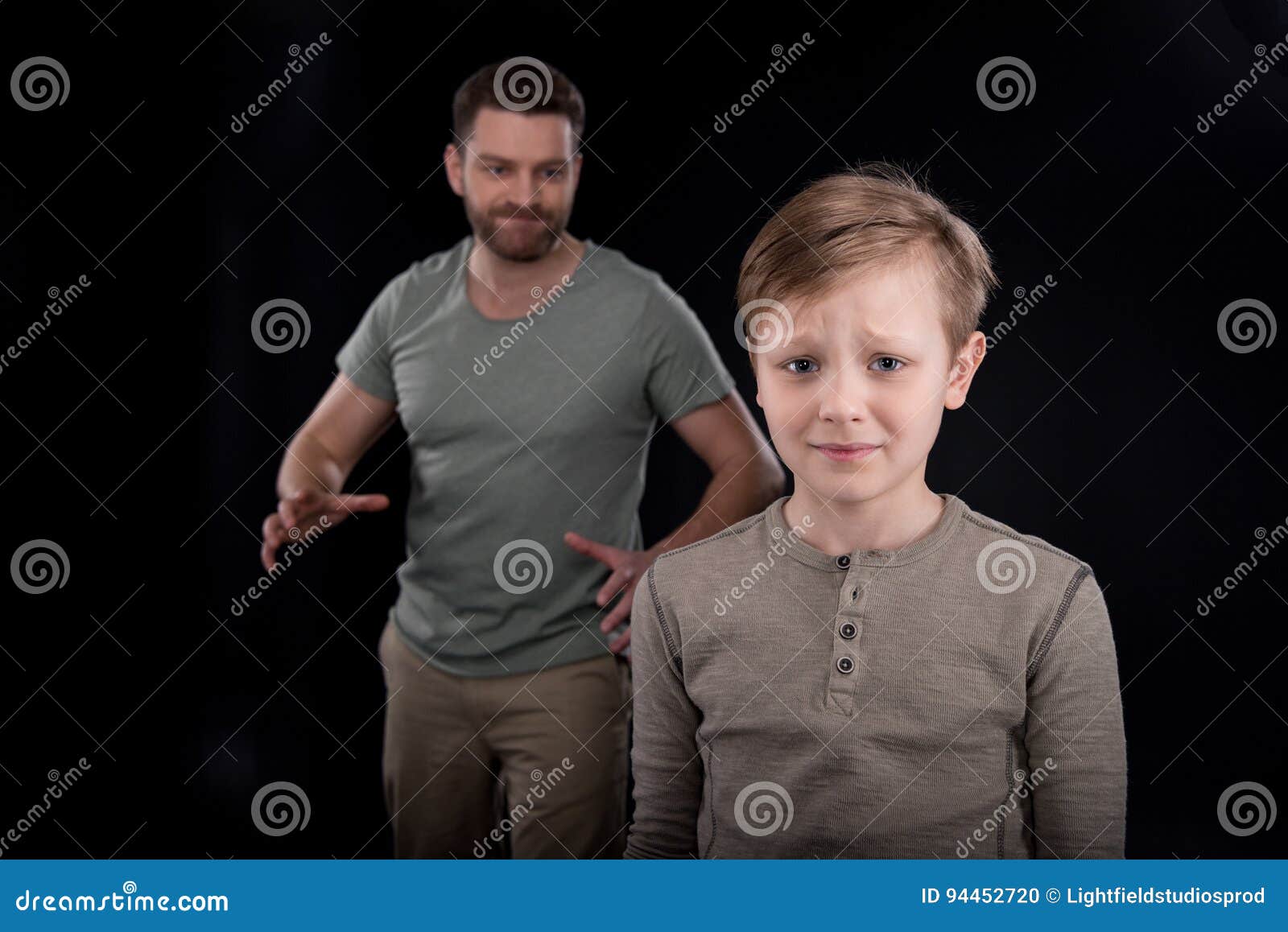 Angry Father Gesturing and Looking at Scared Son Stock Photo - Image of ...