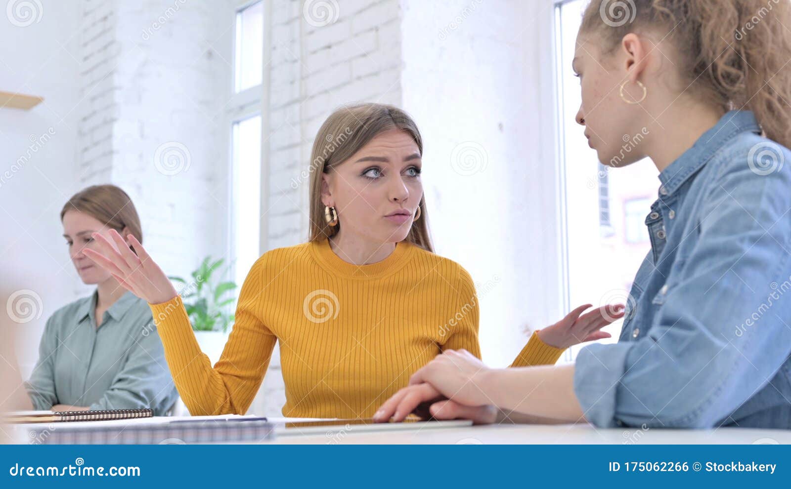 Angry Female Creative Team Having Argument in Office Stock Photo ...