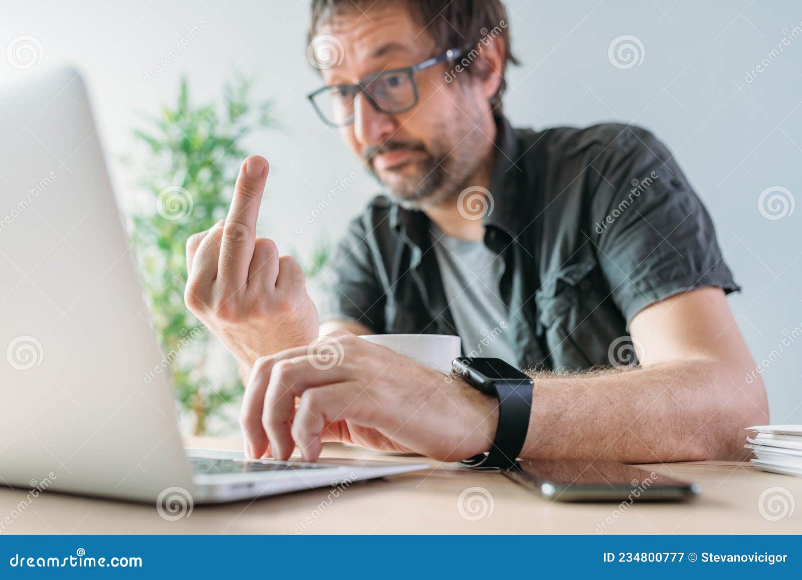 Angry Freelancer Gesturing Middle Finger during Video Conference Call ...