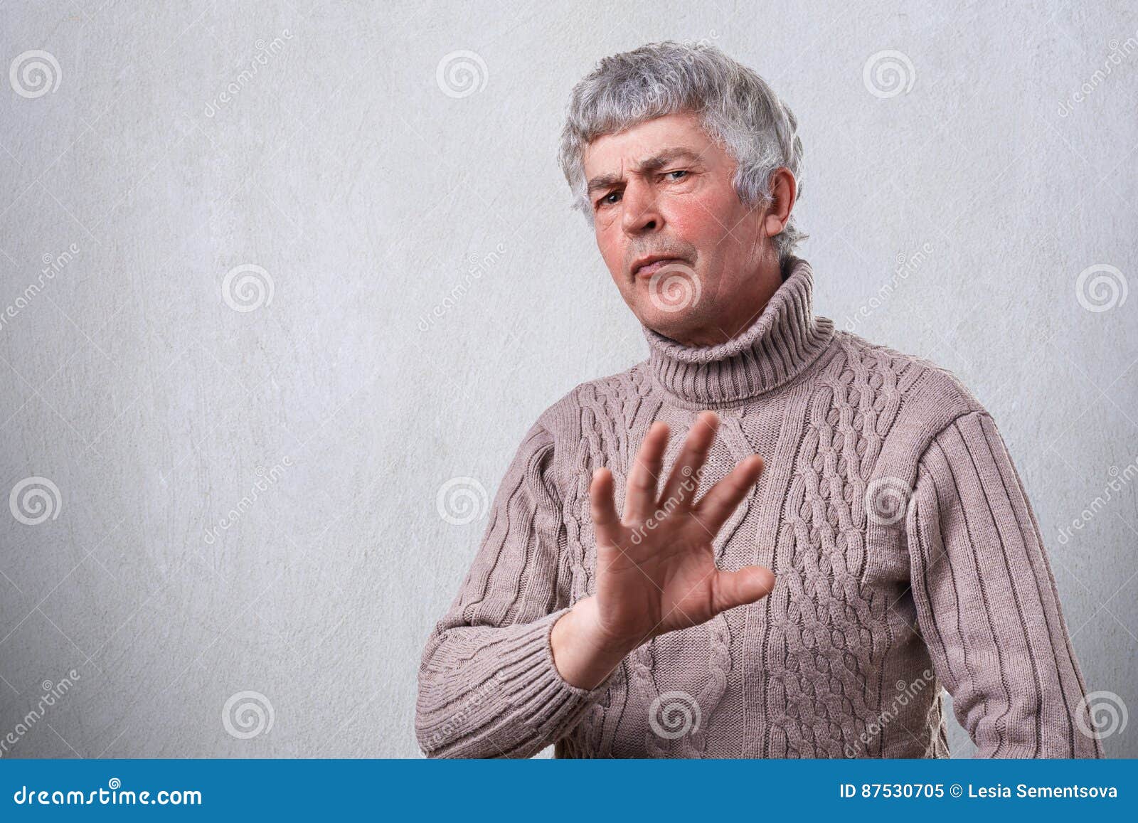 An Angry Frowning Mature Man Having Negative Expression Showing ...