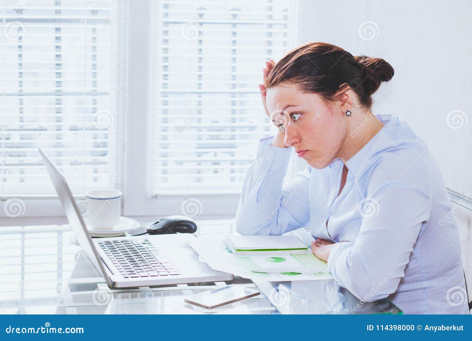 Angry Furious Businesswoman Girl With An Ax Smashes A Laptop Screaming