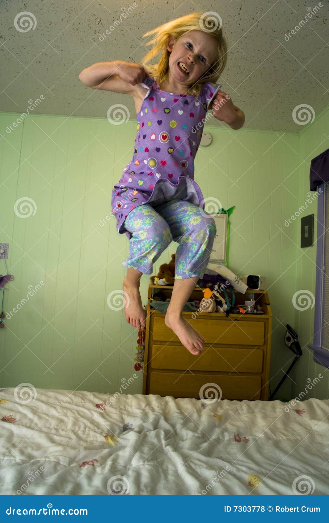 Angry Girl Jumping on a Bed Stock Photo - Image of bedroom, game: 7303778