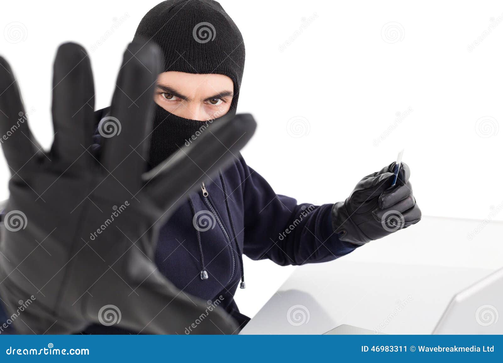 An Angry Hacker In A Mask With A Hood Infiltrates Data Servers And ...