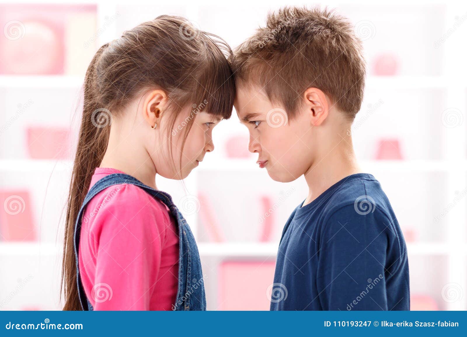 Two Angry Kids Brother And Sister Standing Face To Face, Pointing ...