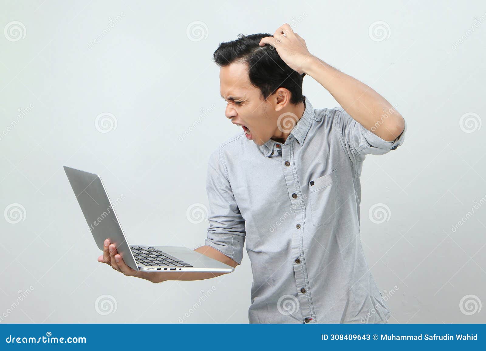 Angry Mad Asian Man Holding Laptop Computer on Isolated Background ...