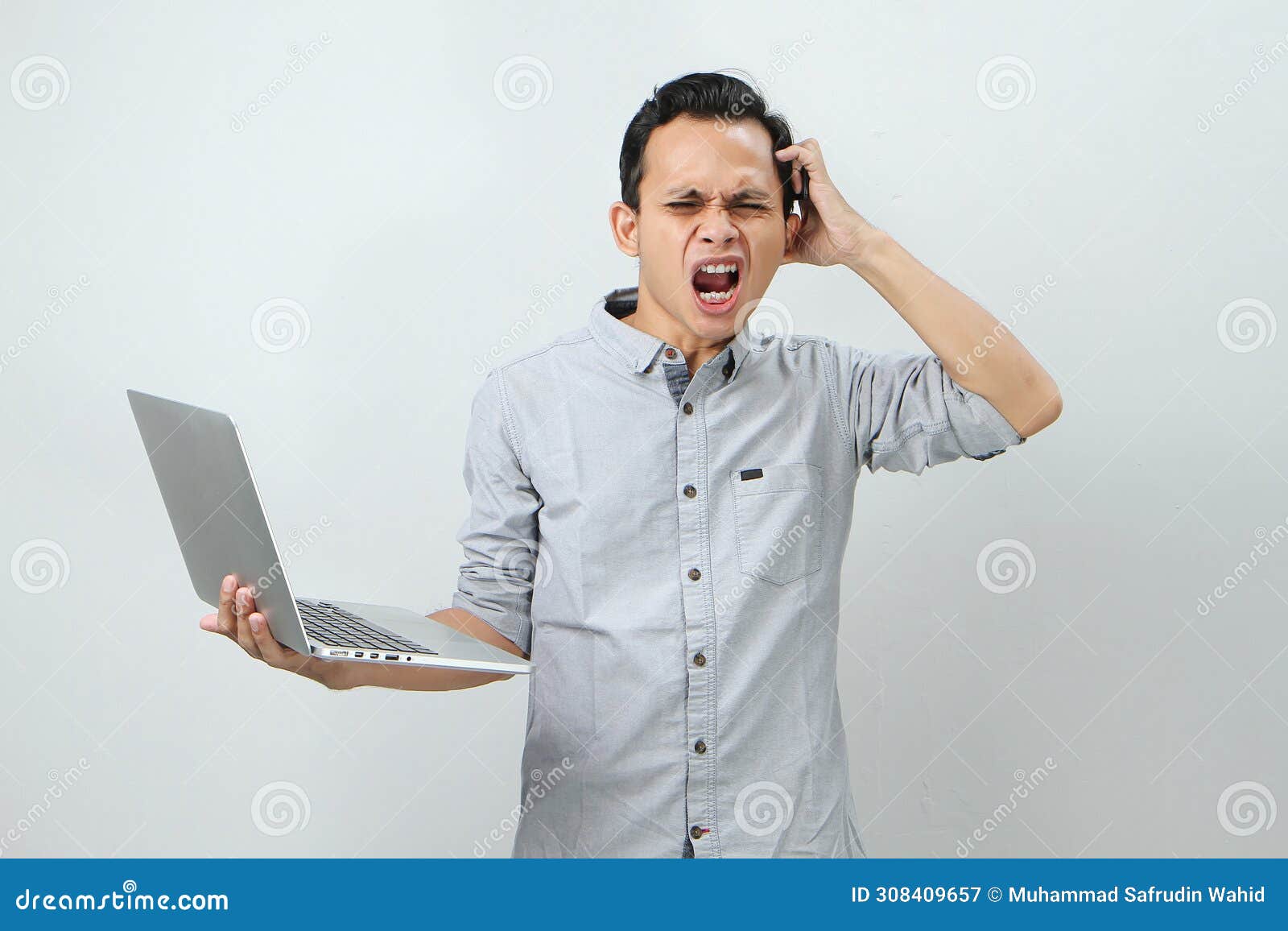 Angry Mad Asian Man Holding Laptop Computer on Isolated Background ...