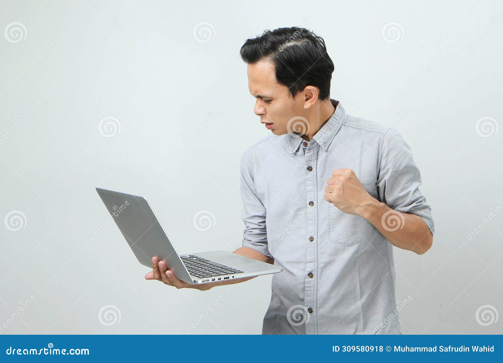 Angry Mad Asian Man Holding Laptop Computer on Isolated Background ...