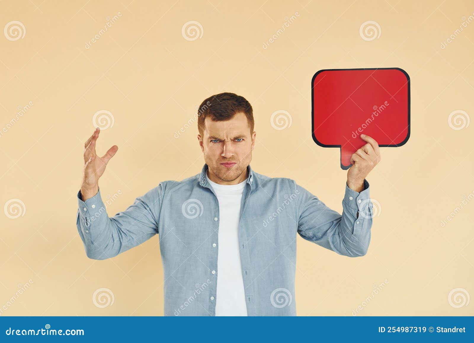 Angry and Mad. Man Standing in the Studio with Empty Signs for the Text ...