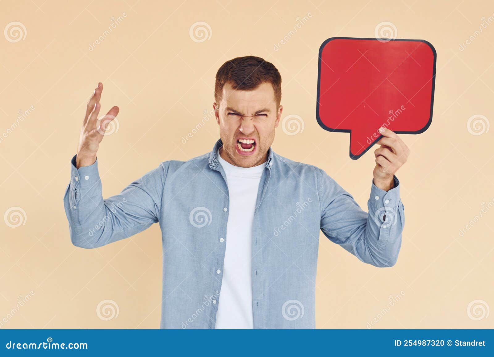 Angry and Mad. Man Standing in the Studio with Empty Signs for the Text ...